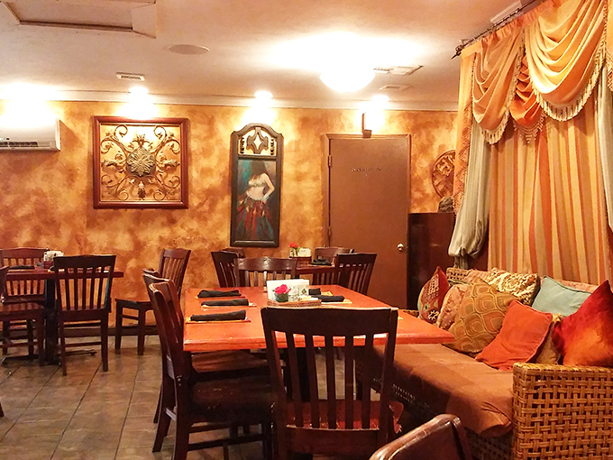 The cozy corner with its golden walls and draped fabrics isn't just seating&mdash;it's a stage set for the memory-making meal that's about to unfold.