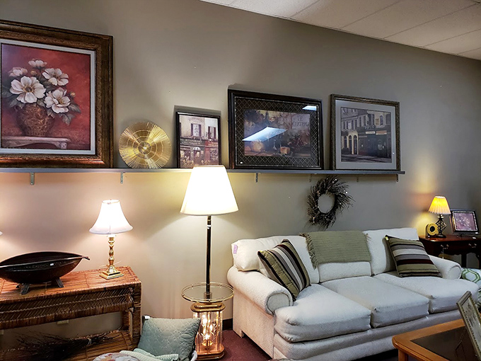 A living room setup that whispers "come sit awhile." The framed artwork above creates an instant atmosphere of homey sophistication.