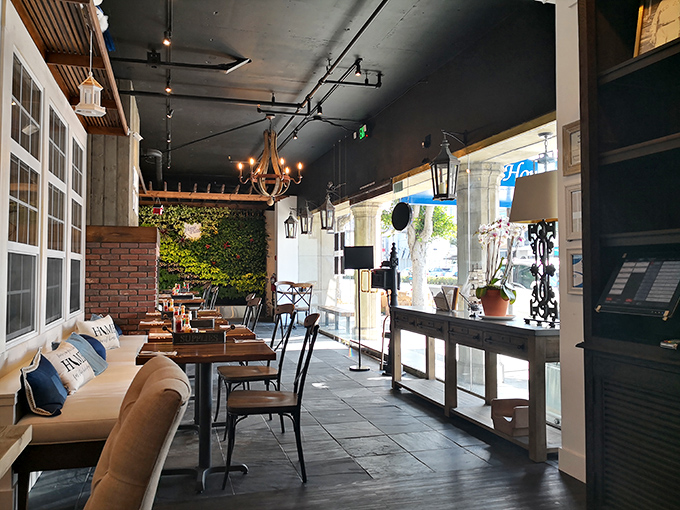 The living room you wish you had&mdash;cozy seating, warm lighting, and the promise of incredible food just steps away.