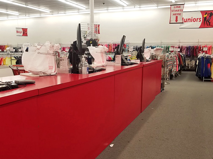 The bright red checkout counter welcomes shoppers like a beacon of bargain-hunting success.