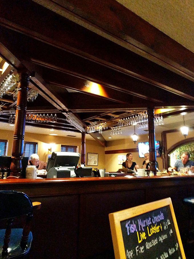 Behind the bar, where seafood magic happens and specials are scrawled on chalkboards with tantalizing descriptions.