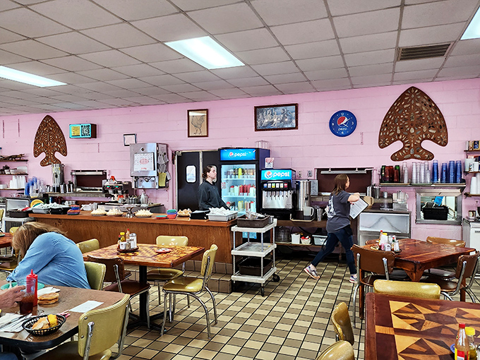Behind the counter, where the magic happens&mdash;pink walls, vintage fixtures, and staff who know many customers by name and order.
