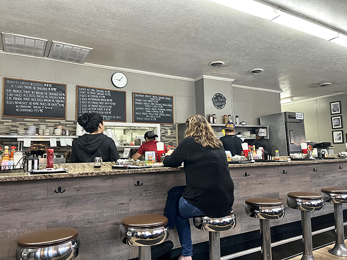 The counter view reveals the beating heart of Five Points&mdash;where orders are called, coffee is poured, and the daily drama of diner life unfolds.