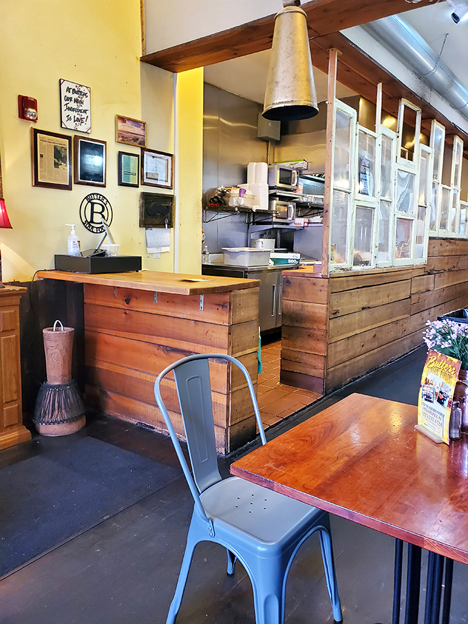 The open kitchen concept lets you witness culinary artistry unfolding in this welcoming, unpretentious space.