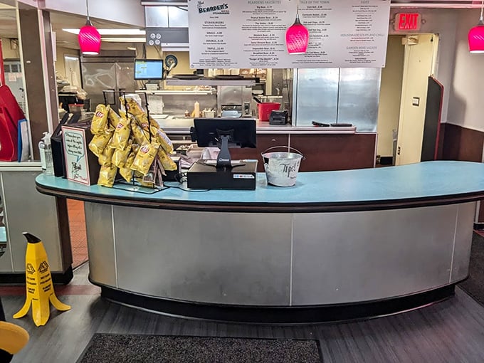 The curved counter with its turquoise top is command central for this operation, where diner magic happens one order at a time.