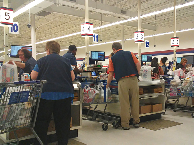 Where the magic happens: checkout lines bustling with cart-comparing shoppers swapping recipes and savings strategies like old friends.