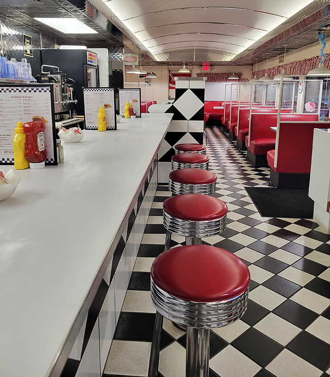 A row of empty red stools awaiting their next patrons&mdash;like front-row seats to the greatest show on earth: breakfast served all day.