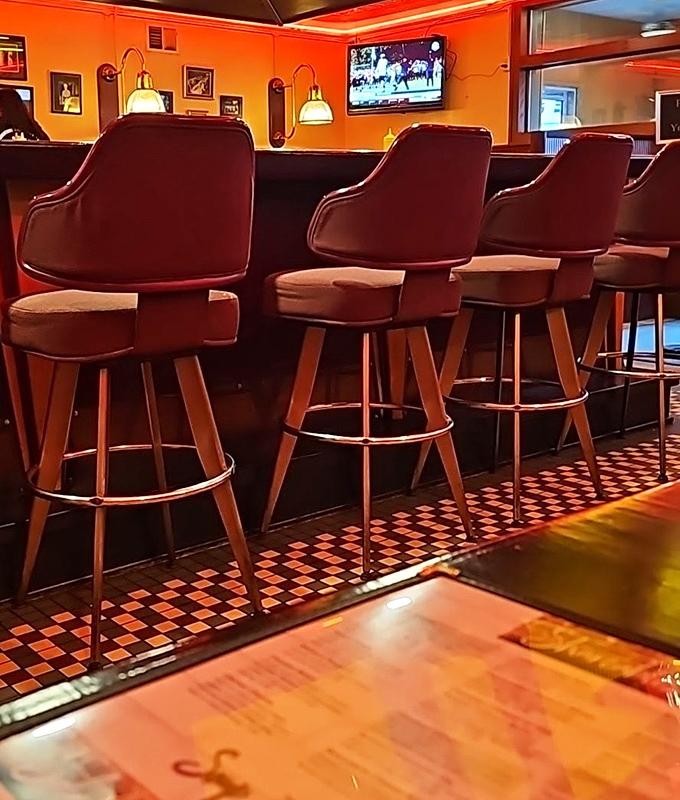 These bar stools have supported generations of Ohioans, their worn seats telling stories of countless meals, drinks, and local gossip sessions.