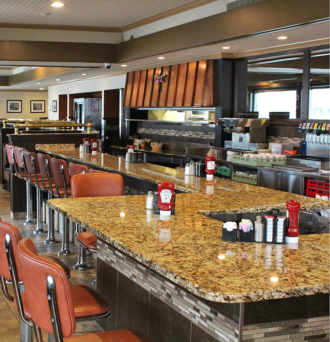 Counter seating: where solo diners become temporary family and breakfast becomes dinner theater with front-row seats to the culinary action.