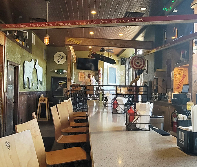 Counter seating offers front-row tickets to the culinary show. Note the wooden chairs bearing the graffiti of satisfied diners past.