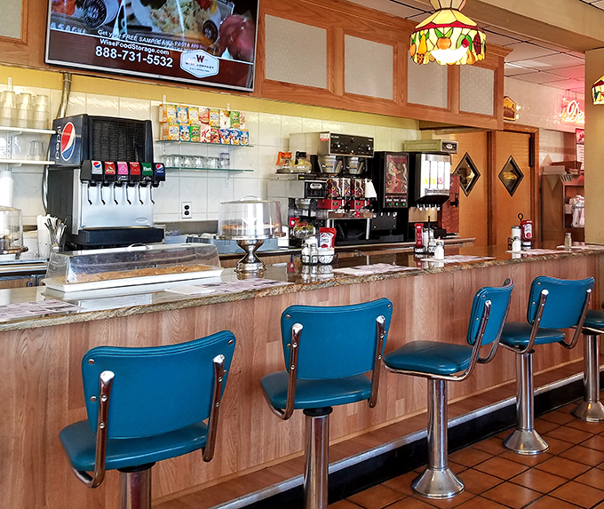 The counter with its blue swivel chairs&mdash;where solo diners find community and the coffee never stops flowing. Diner diplomacy at its finest.