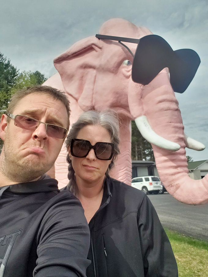 Ellie photobombs another Tennessee memory, her pink trunk and sunglasses creating the perfect backdrop for capturing that "we were here" moment.