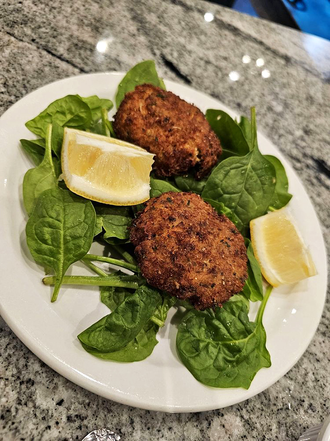 Crab cakes golden and generous, proving that sometimes the ocean's treasures are worth celebrating.