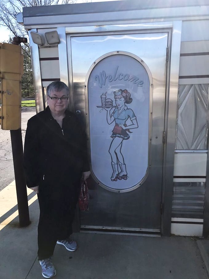 The entrance features a charming retro waitress illustration, welcoming visitors to step back in time for a meal that transcends trends.
