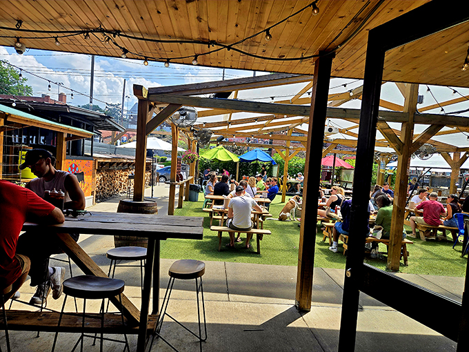 The outdoor seating area buzzes with the energy of people united by a common purpose: the pursuit of exceptional barbecue in the Pittsburgh sunshine.