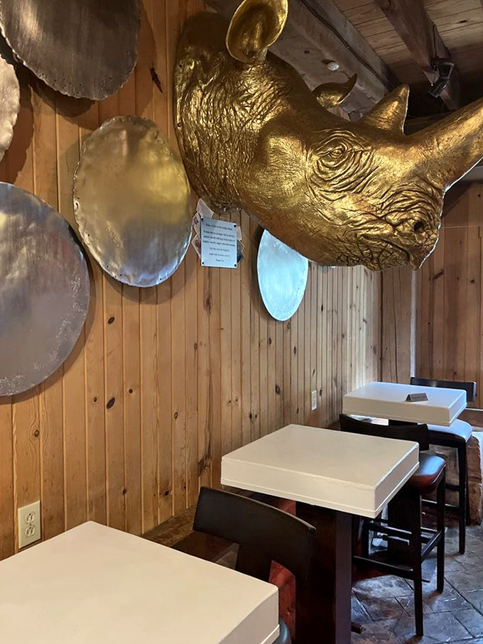 That golden rhino on the wall watches over diners like a whimsical guardian of good taste and great times.