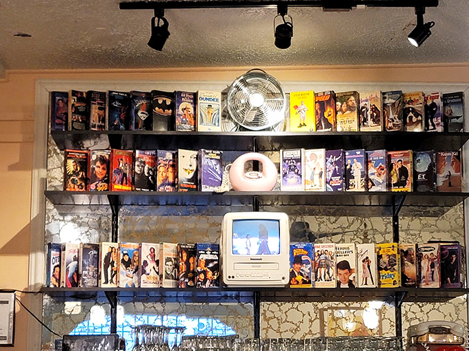 VHS tapes line the shelves like a museum of movie nights past&mdash;a charming reminder of when "streaming" just meant you forgot to rewind.