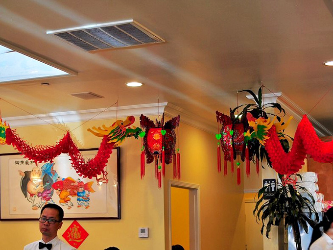 Festive Chinese decorations add splashes of color overhead while diners below focus on the real artwork &ndash; what's on their plates.
