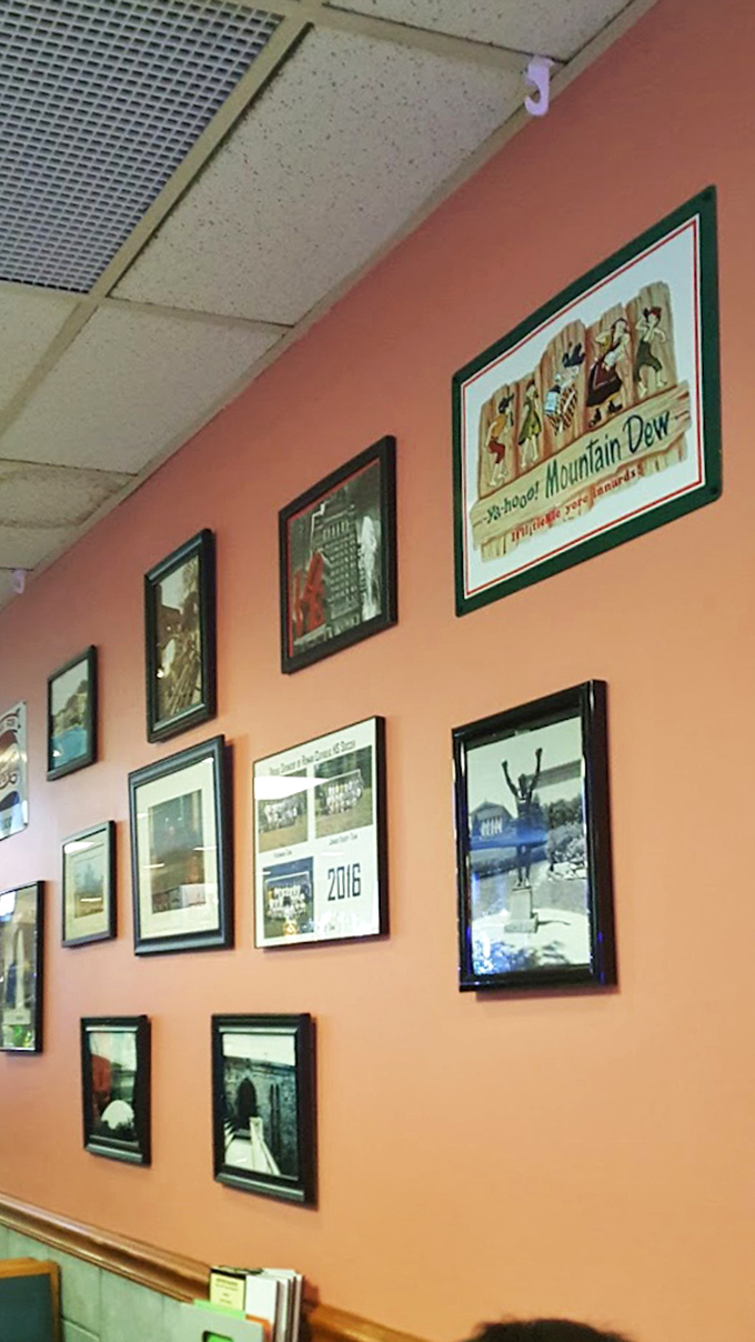 The wall of fame showcases Philadelphia pride alongside vintage advertisements. Every picture tells a story of a city that knows good food.