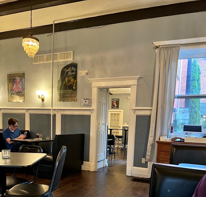 Blue-gray walls and vintage posters create dining rooms where conversations flow as easily as the drinks, and nobody's checking their watch.