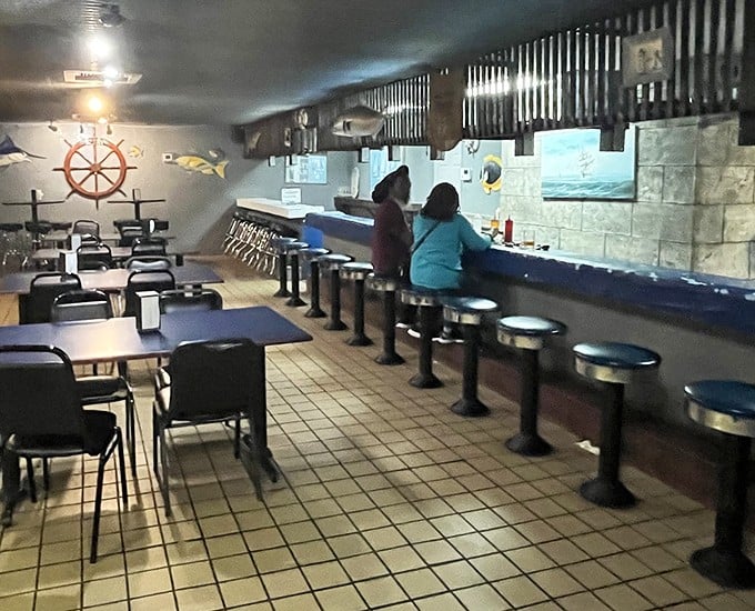 The oyster bar in action&mdash;where strangers become friends united by the universal language of "pass the hot sauce" and "aren't these amazing?"