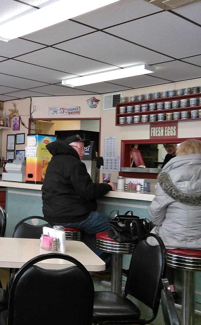 The breakfast counter ballet: regulars perched on chrome stools, waitstaff navigating the space with practiced ease, and coffee cups never reaching empty.
