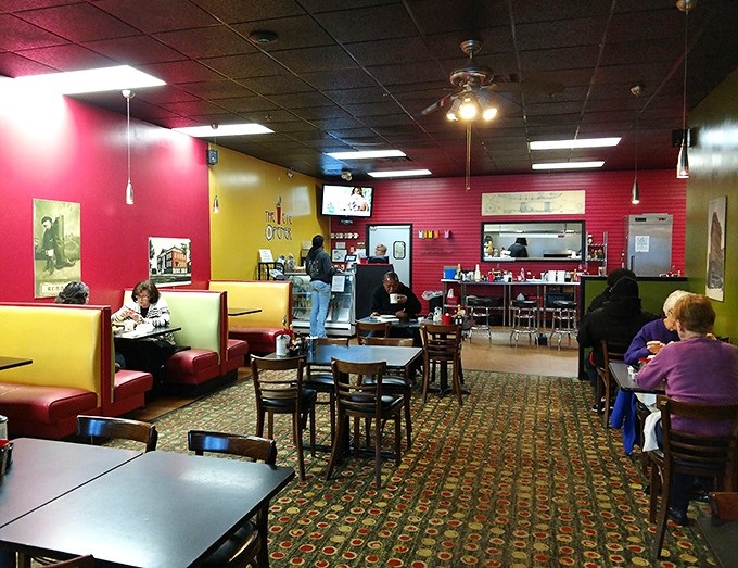 A colorful dining area where breakfast stories unfold daily&mdash;some tables witness first dates while others host decades-long friendship rituals.