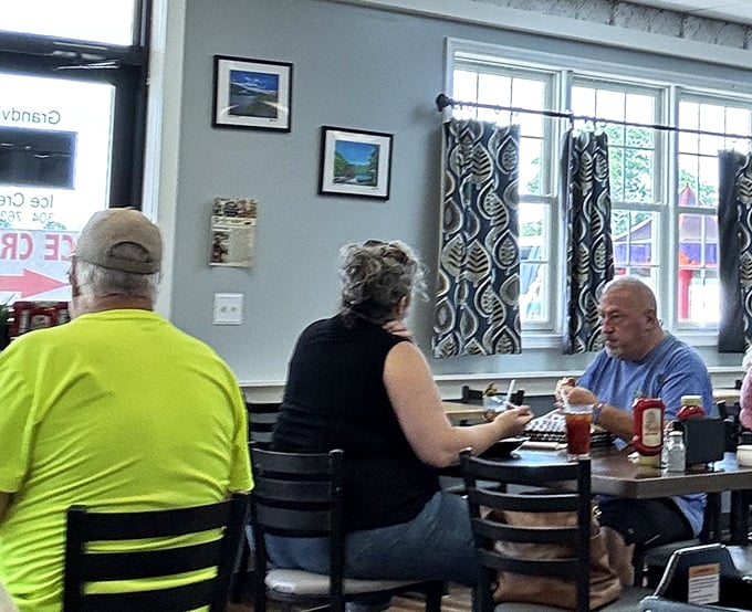 Where strangers become united by the universal language of good food. Notice the focused expressions&mdash;that's what culinary bliss looks like.