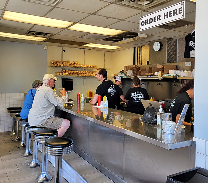 The counter creates a community of strangers united by one noble pursuit: the perfect burger experience. Conversations flow as freely as ketchup.