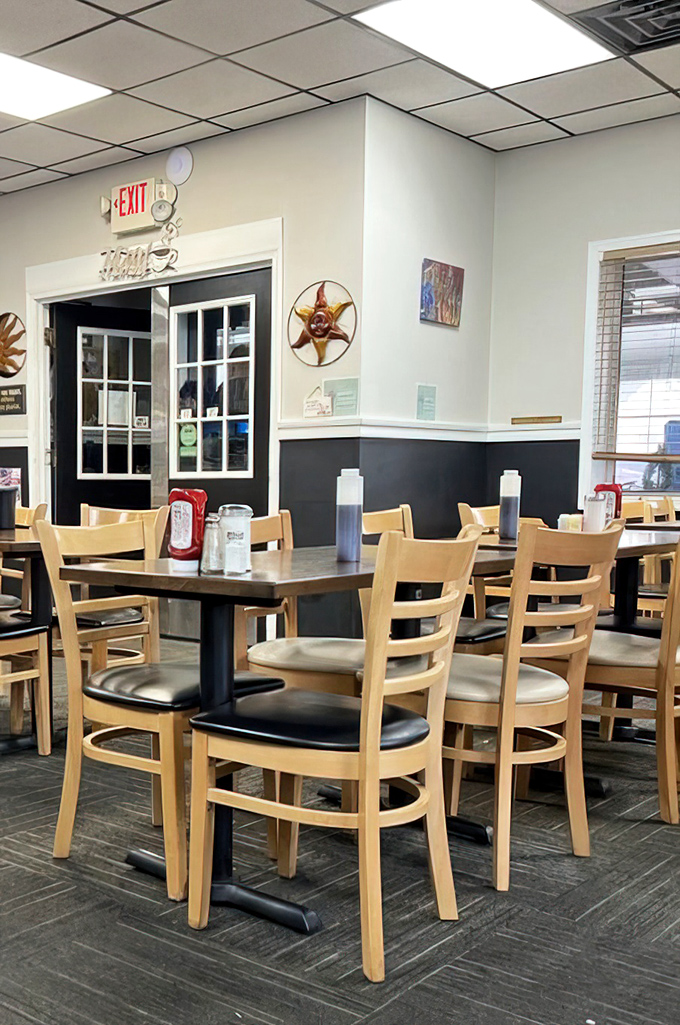 Light wood chairs and clean lines create a welcoming space where coffee flows freely and breakfast dreams come true.