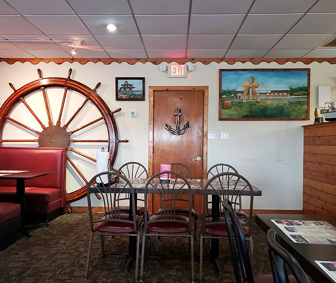 Another angle of the dining room reveals the perfect balance of maritime kitsch and practical comfort&mdash;where memories are made between bites.