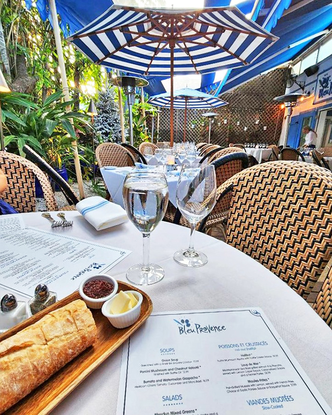 Blue and white striped umbrellas create the perfect setting for pretending you're in Saint-Tropez instead of Southwest Florida.