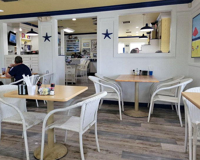 White chairs, blue accents, and the promise of coffee refills. This dining room isn't just a space&mdash;it's the stage where breakfast dreams come true.