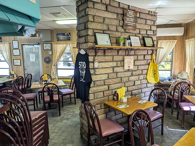 The dining room's brick column stands like a sentinel, witnessing decades of family gatherings, first dates, and travelers discovering their new favorite breakfast spot.