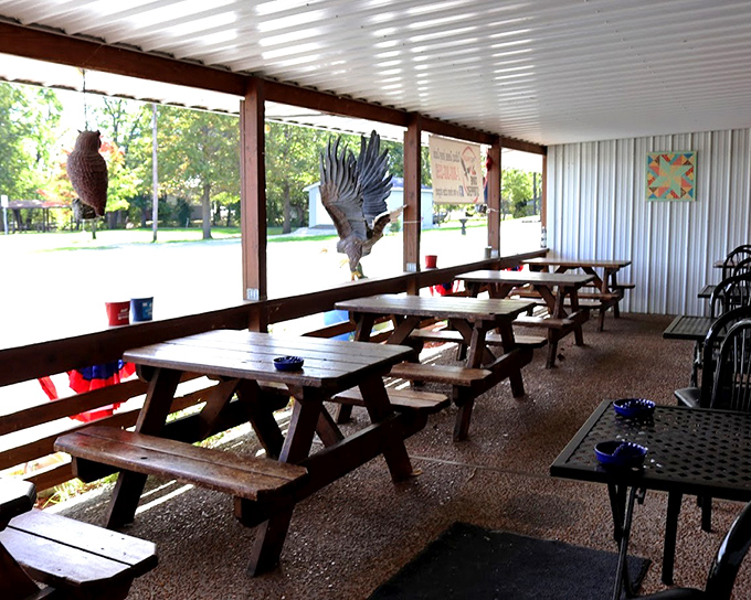 The covered patio where picnic tables and eagle decorations remind you that you're dining in America's heartland, not some coastal bistro with tiny portions.
