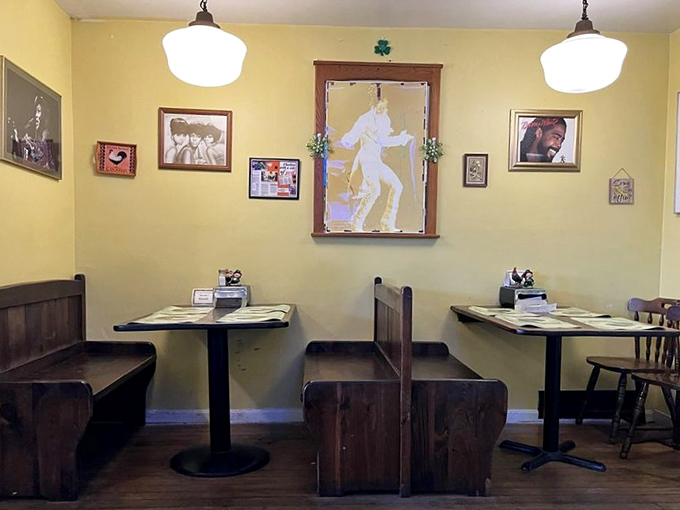 Church pew booths and simple tables create a dining room that feels like Sunday dinner at grandma's&mdash;if grandma were a fried chicken virtuoso.