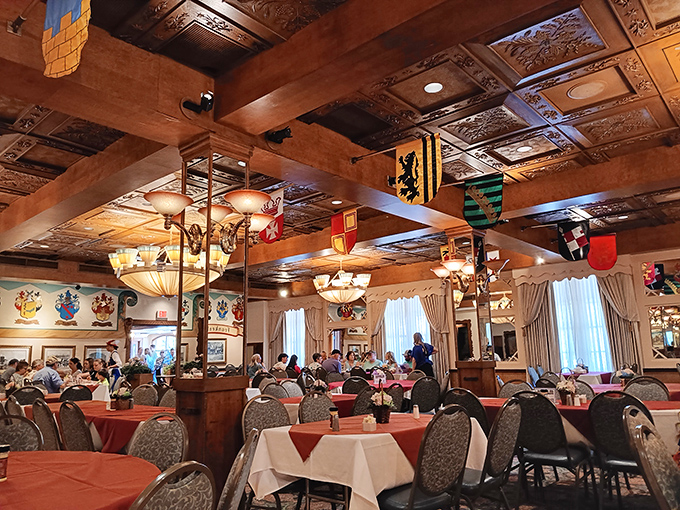 Red tablecloths, wooden beams, and hanging flags create the perfect backdrop for pretending you're in Bavaria instead of the Midwest.
