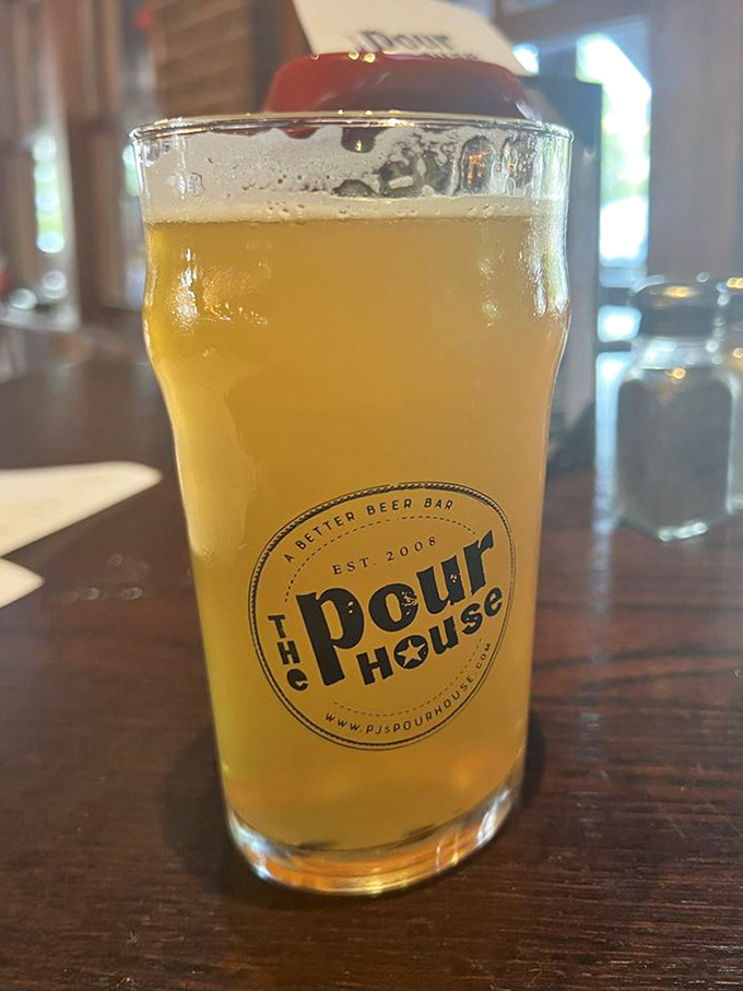 Local brews served in signature glassware prove that good beer deserves proper presentation and unhurried appreciation every single time.