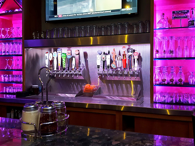 The tap system gleams under purple-pink lighting, promising craft beers that pair perfectly with pizza&mdash;like a high-tech beer rainbow leading to a pot of flavor gold.