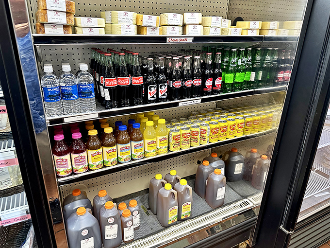 The beverage case: where sweet tea flows like liquid gold and sodas stand at attention, ready to wash down whatever comfort food you've chosen.