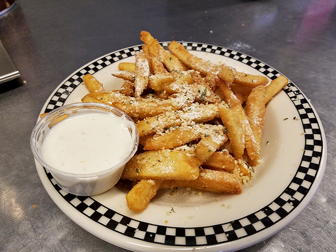 "Eastside Fries"&mdash;golden potato sticks dusted with parmesan and served with dipping sauce. Proof that sometimes the simplest pleasures are the most satisfying.