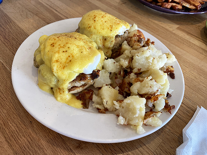 Eggs Benedict done right: a hollandaise so perfect it makes you wonder why anyone bothers with avocado toast anymore.