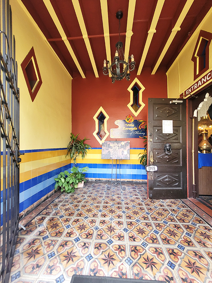 The entrance beckons with its vibrant tiles and geometric doorway&mdash;like a portal to another world that happens to be ADA-compliant.