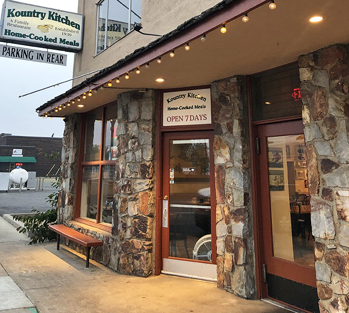 String lights and stone walls create the kind of entrance that says, "Come on in, stranger&mdash;but you won't leave as one."