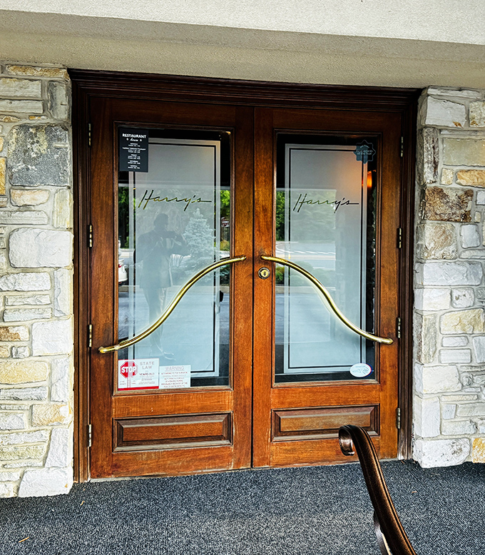 Elegant entrance doors with etched glass promise the kind of dining experience that turns regular Tuesday nights into special occasions worth celebrating.