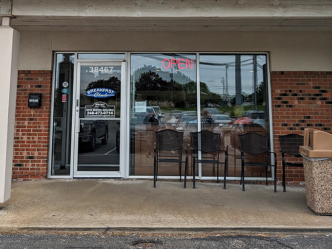 The entrance promises simplicity with its "OPEN" sign, but the menu behind those doors is anything but basic.