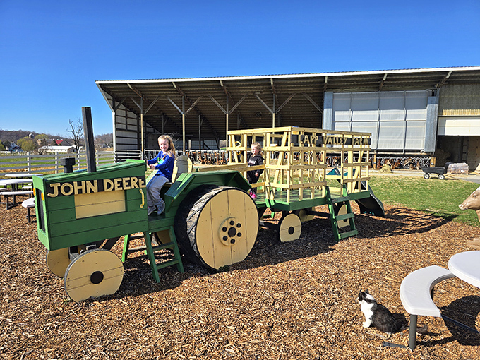 Farm fun beyond ice cream&mdash;a wooden John Deere tractor where kids can play farmer while parents debate second scoops.