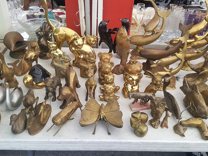 A brass menagerie that would make any maximalist's heart skip a beat. Nothing says "I have interesting taste" quite like a golden butterfly next to a brass duck.
