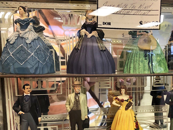 Vintage figurines frozen in Victorian elegance&mdash;like tiny time travelers waiting to bring some historical charm to your modern bookshelf.