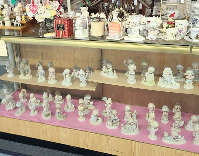Precious Moments figurines frozen in perpetual cuteness. This display has enough wide-eyed porcelain children to populate a small, extremely wholesome village.